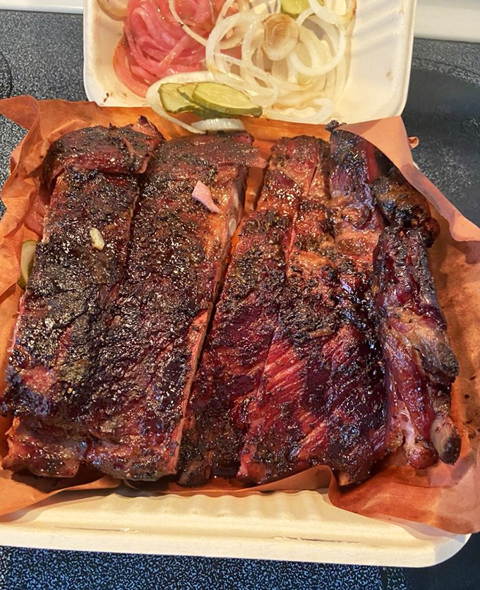 These ribs don't just fall off the bone&mdash;they practically leap into your mouth with that perfect bark and smoke ring that would make a pitmaster weep.