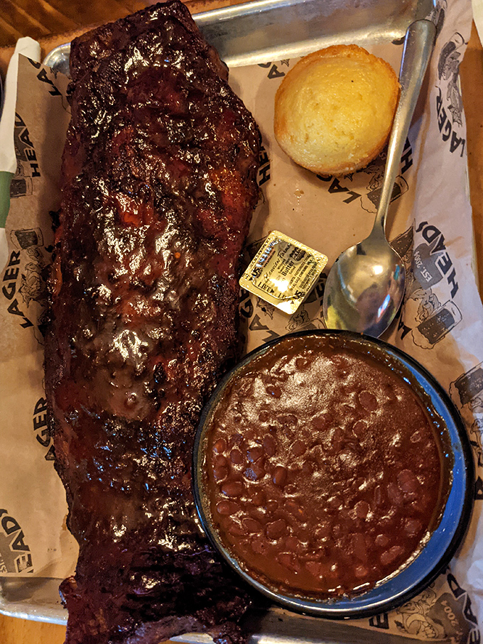 These ribs don't just fall off the bone; they practically perform a choreographed dance into your mouth, with baked beans playing backup.