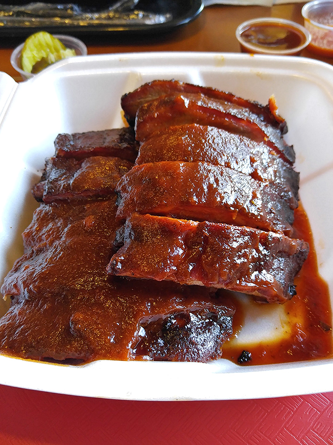 These ribs aren't just falling off the bone&mdash;they're practically jumping into your mouth, wearing a glossy sauce coat that should be featured in food fashion magazines.