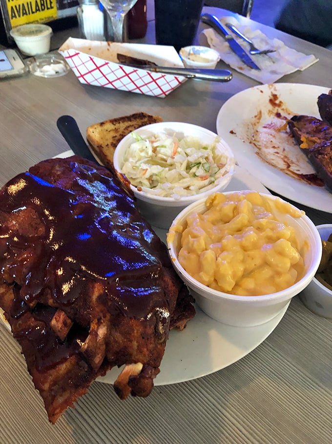 These ribs don't just fall off the bone—they practically leap into your mouth with purpose. The mac and cheese looks like it's auditioning for a comfort food calendar.