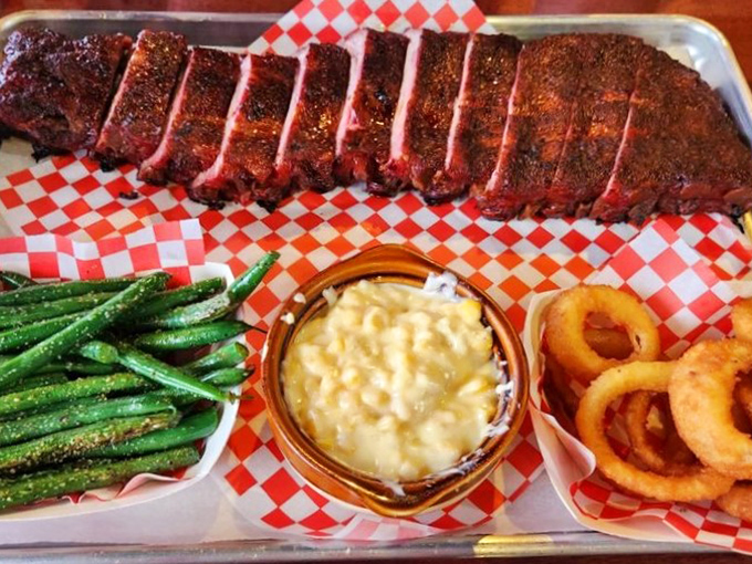 Behold the ribs in their crimson-crusted glory. That smoke ring isn't just for show&mdash;it's the pink badge of honor that signals BBQ perfection.