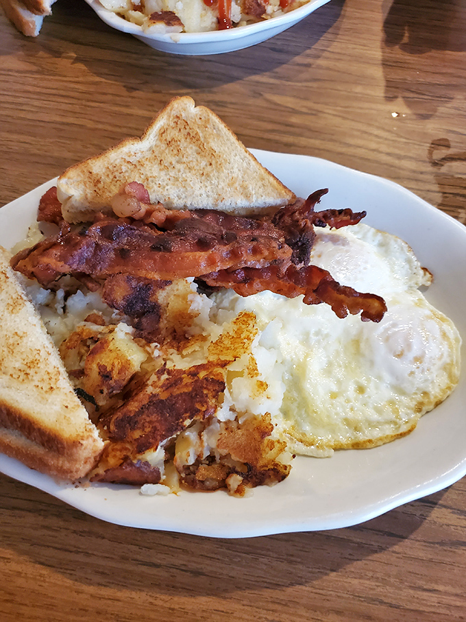 Breakfast perfection doesn't need fancy plating&mdash;just perfectly crisp bacon, golden home fries, and eggs that sunshine on your plate.
