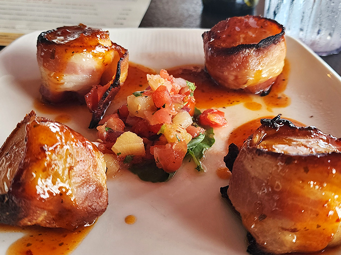 These bacon-wrapped scallops aren't just appetizers&mdash;they're tiny flavor bombs where smoky meets sweet in perfect harmony.