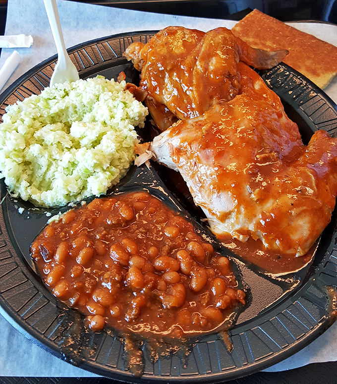 Southern harmony on a plate: smoky chicken, tangy beans, and fresh slaw creating a trio more satisfying than the Avett Brothers on a summer night.