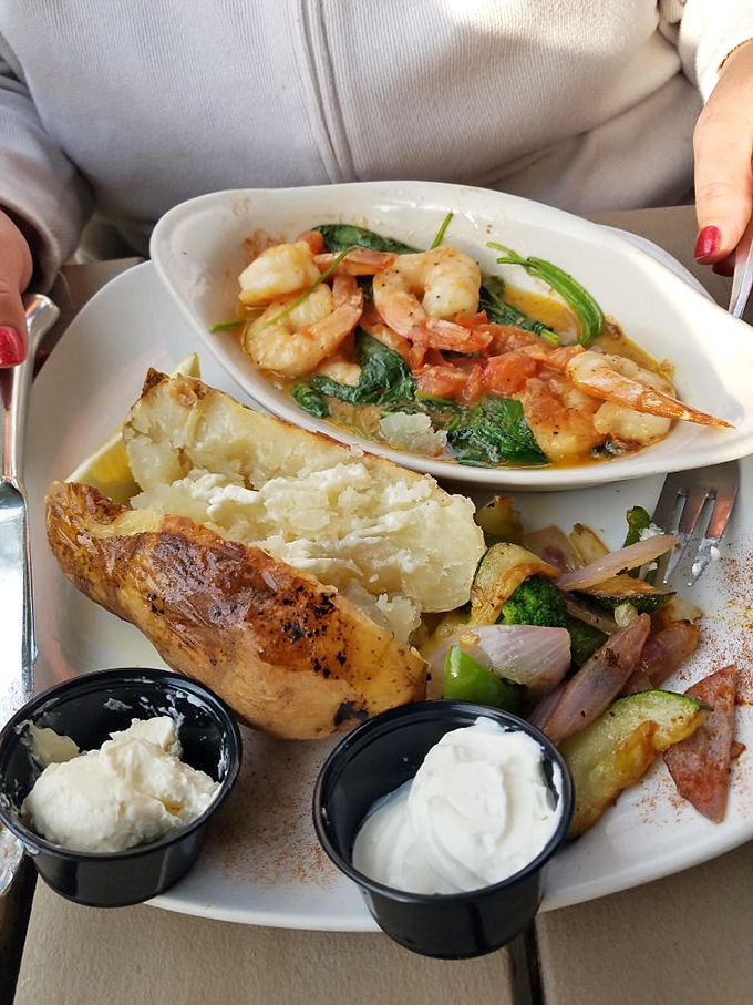 This isn't just a baked potato&mdash;it's a canvas for culinary creativity, accompanied by plump shrimp that would make any seafood lover swoon.