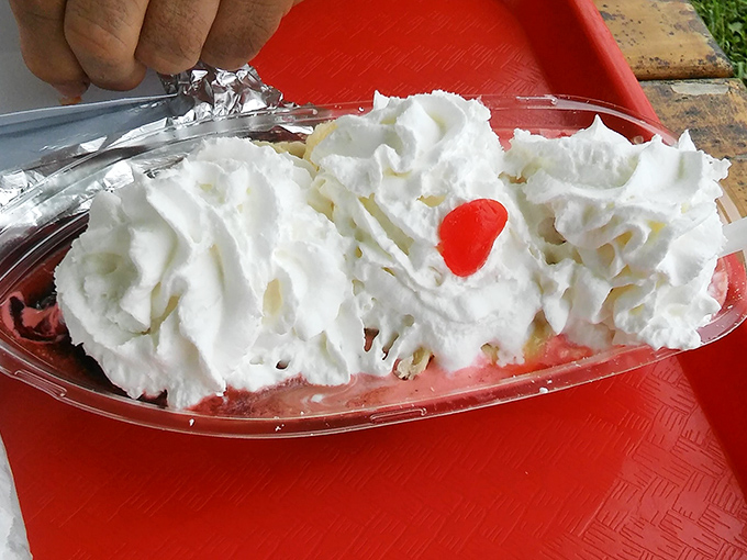 Behold the banana boat: where whipped cream mountains meet their tropical destiny in glorious, spoon-bending harmony.