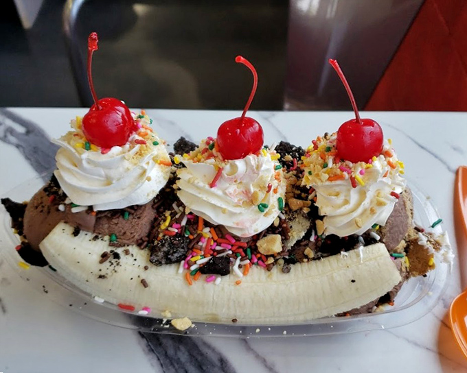 The banana split that launched a thousand road trips. Three scoops, one banana, and enough toppings to make your dentist buy a vacation home.