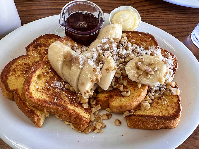 French toast that could make a Parisian jealous, crowned with bananas and walnuts in a display of morning decadence.