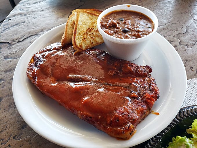 That glistening slab of meat isn't just food &ndash; it's edible architecture with a mahogany exterior giving way to tender pink perfection underneath.