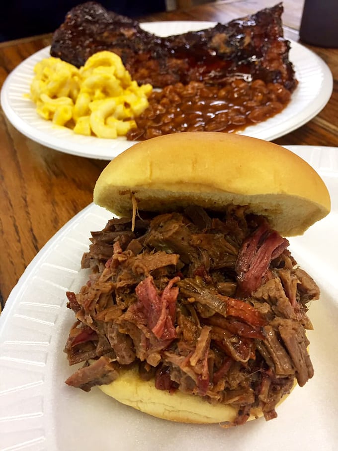 Meat masterpiece alert! This pulled pork sandwich isn't just food &ndash; it's edible art, with tender strands of smoky goodness piled high on a pillowy bun.