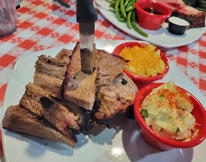 Brisket so tender it practically surrenders at the sight of your fork. Those little red side dishes aren't just accessories&mdash;they're supporting actors in a meaty masterpiece.