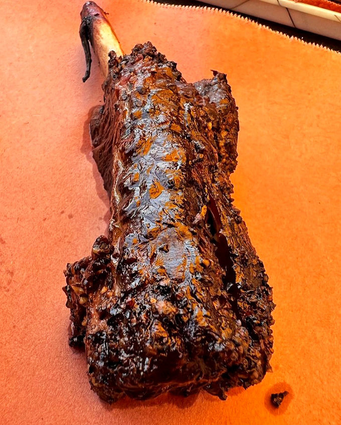 The beef rib that launched a thousand road trips. This prehistoric-looking masterpiece has the kind of bark that makes tree trunks jealous.