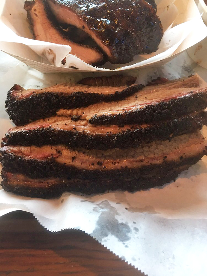 Behold the holy grail of Texas barbecue &ndash; brisket with a bark so perfect it should be in a museum. That smoke ring is nature's way of saying "you're welcome."