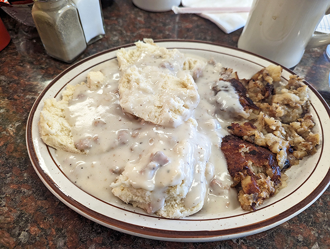 Biscuits swimming in creamy sausage gravy&mdash;the kind of breakfast that makes you want to buy a bigger belt and zero regrets.