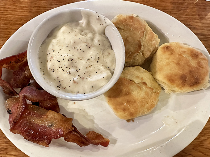 Behold the star attraction: fluffy biscuits with pepper-speckled sawmill gravy. Breakfast nirvana achieved, diet resolutions postponed.