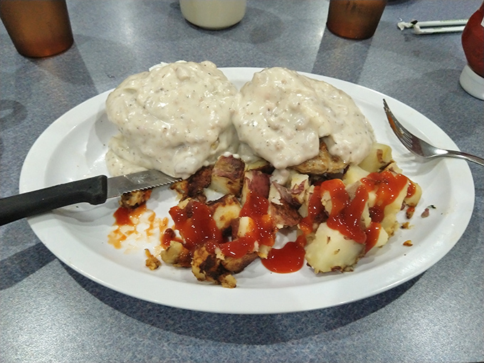 Biscuits and gravy so good they should require a permission slip. Those flaky islands floating in a sea of peppery gravy might change your life.