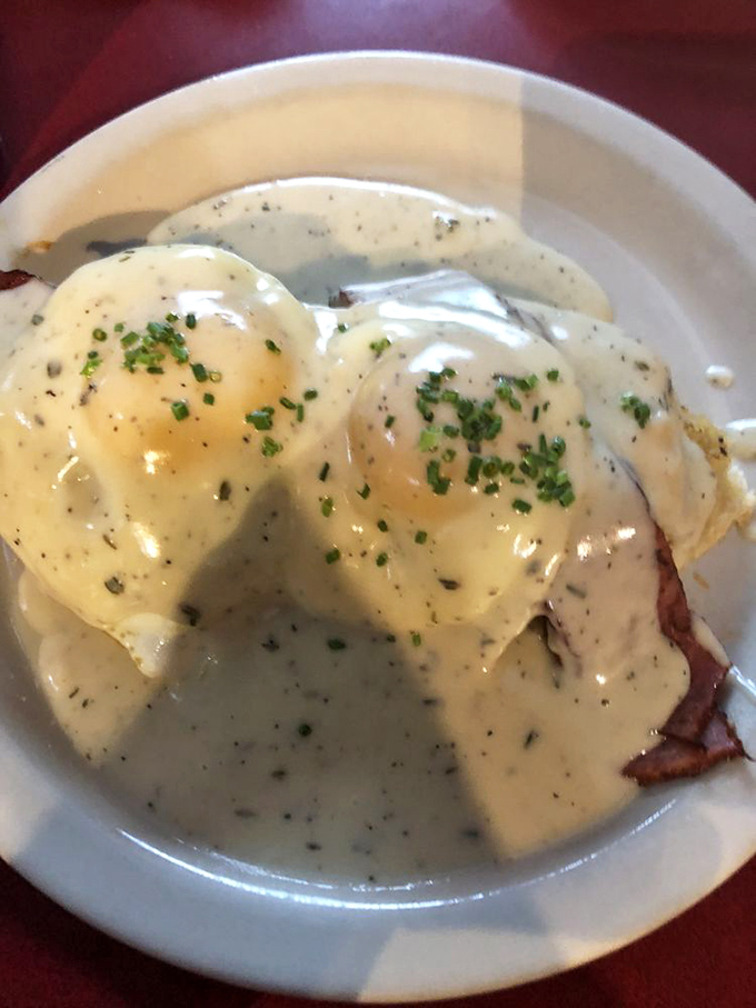 Eggs Benedict gets the Southern treatment with a blanket of herb-flecked gravy so velvety it could make a cardiologist weep with both concern and envy.