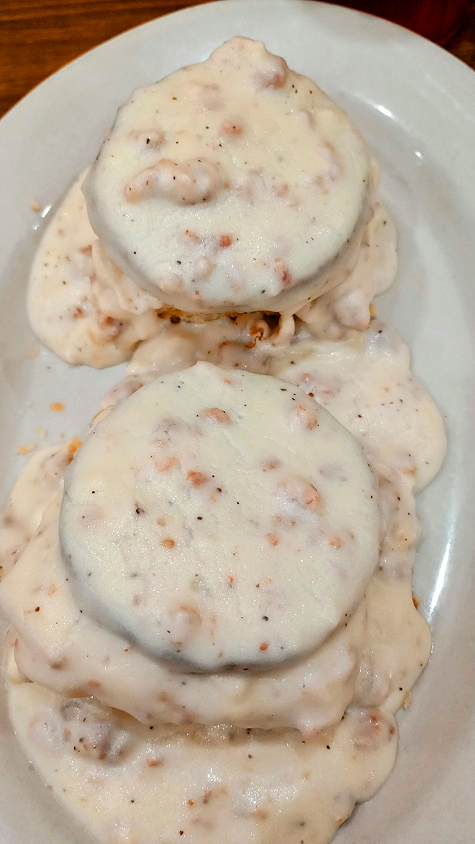 Biscuits swimming in creamy, peppery gravy&mdash;a Southern baptism that transforms ordinary mornings into religious experiences. Calories? What calories?