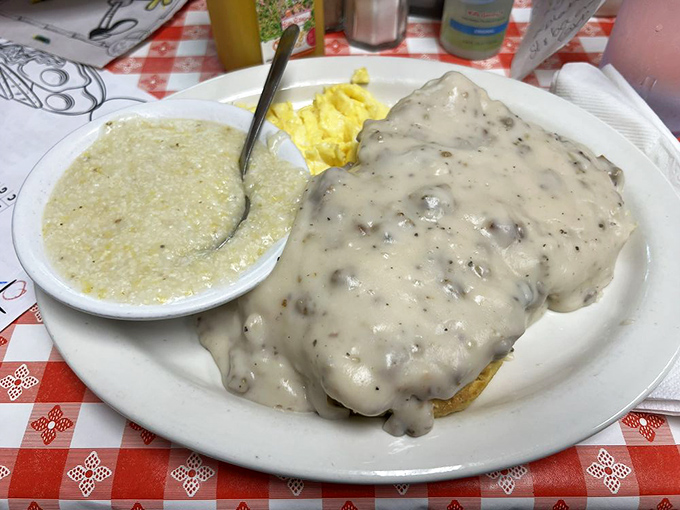 Biscuits smothered in country gravy so thick you could stand a spoon in it. This isn't breakfast&mdash;it's edible Southern comfort.
