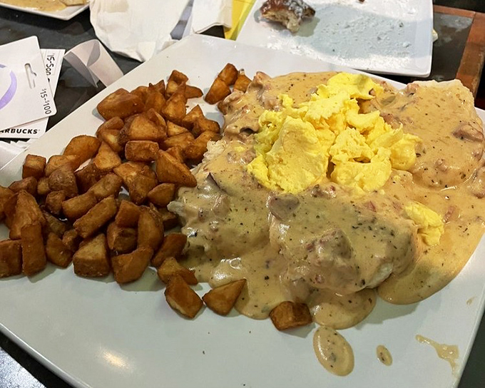 Behold the legendary biscuits and gravy! Those golden home fries aren't just a side dish—they're the supporting actors in a breakfast Oscar winner.