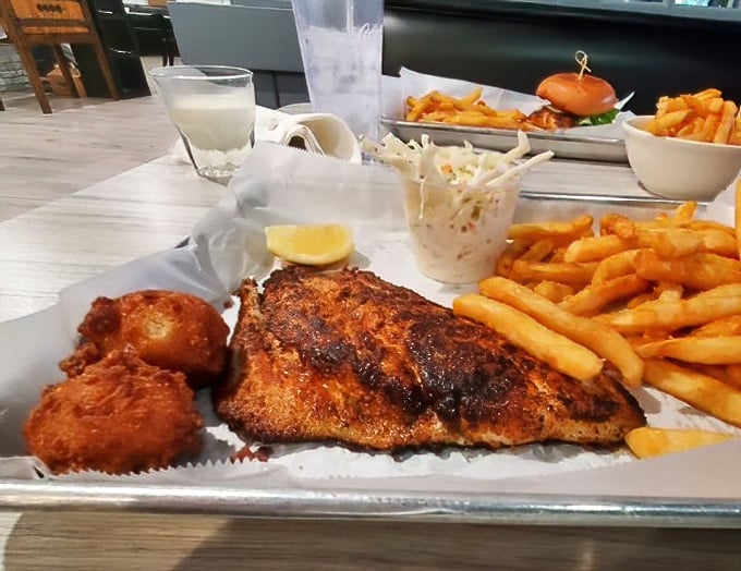 Blackened perfection meets golden fries &ndash; this trigger fish doesn't just swim into your mouth, it dances there.