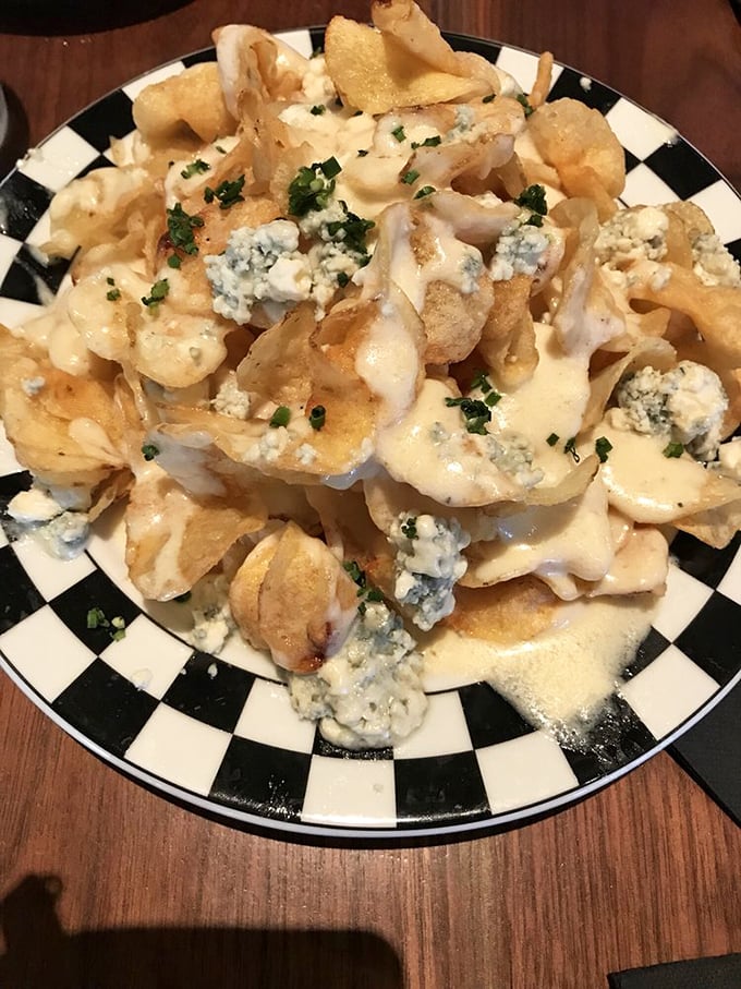 The legendary Blue Cheese Chips&mdash;a mountain of crispy potato perfection drowning in tangy cheese sauce. Worth every mile of the journey.