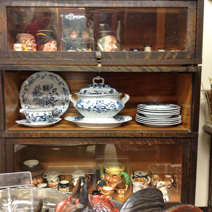 Character mugs peek out above while classic Blue Danube china waits patiently below. Grandma would approve of this proper porcelain reunion.