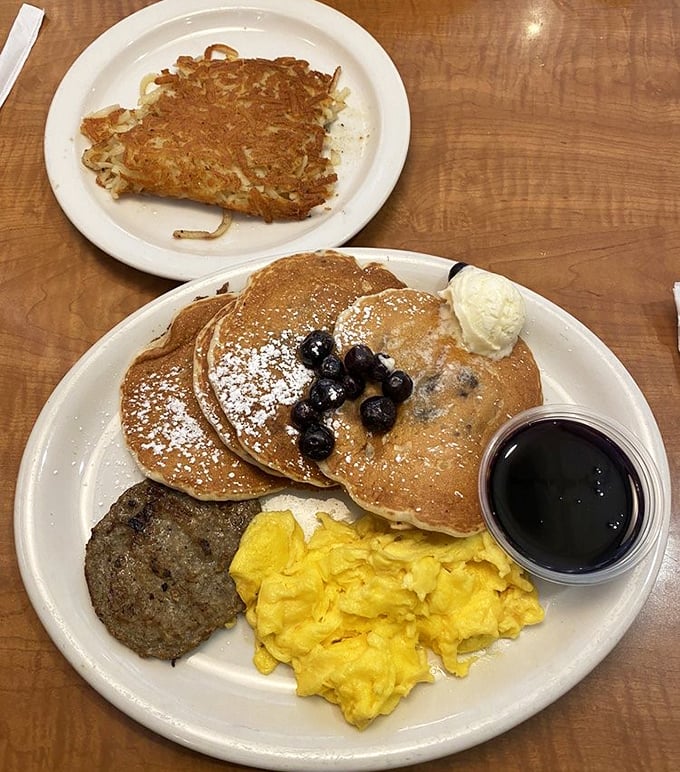 Blueberry pancakes that deserve their own Instagram account, paired with eggs so perfectly yellow they could brighten even Monday mornings.