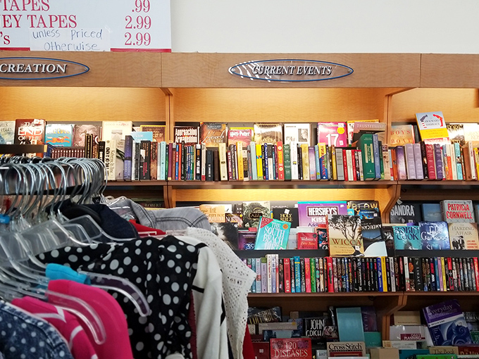Books organized by "Recreation" and "Current Events"—the thrift store version of Netflix categories. Someone's discarded beach read might become your next literary obsession.