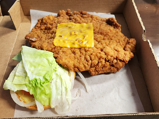 This breaded tenderloin sandwich doesn't just hang over the plate&mdash;it declares territorial rights to the entire table.