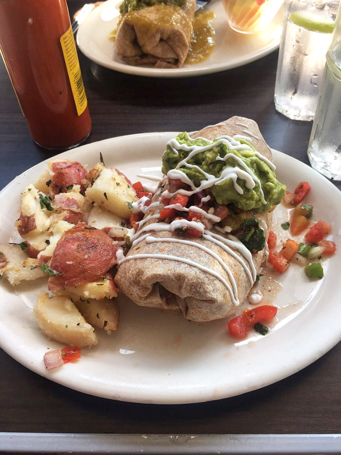 The breakfast burrito in its natural habitat&mdash;a perfect ecosystem of protein, potatoes, and fresh pico, with strategic drizzles of sour cream and guacamole.