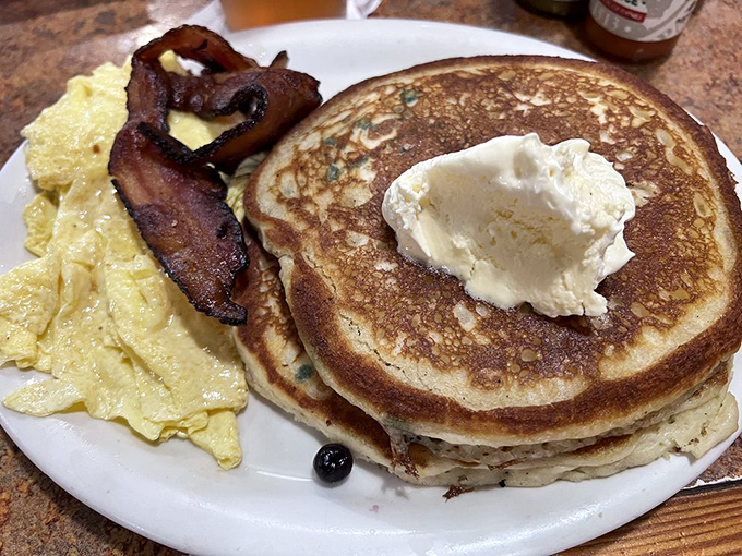 Pancakes so fluffy they could float away, eggs that shine like the Florida sun, and bacon that makes you question all other bacon.