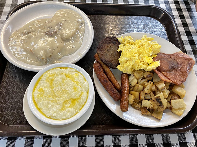Breakfast nirvana: scrambled eggs, country ham, and grits swimming in butter &ndash; the holy trinity of Southern morning rituals.