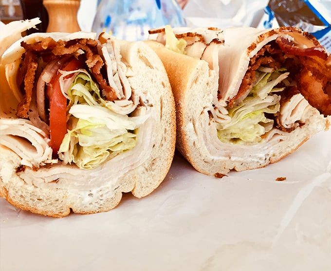 Layers of thinly sliced meats, fresh veggies, and cheese create a masterpiece that makes you wonder why you'd ever waste time on lesser sandwiches.