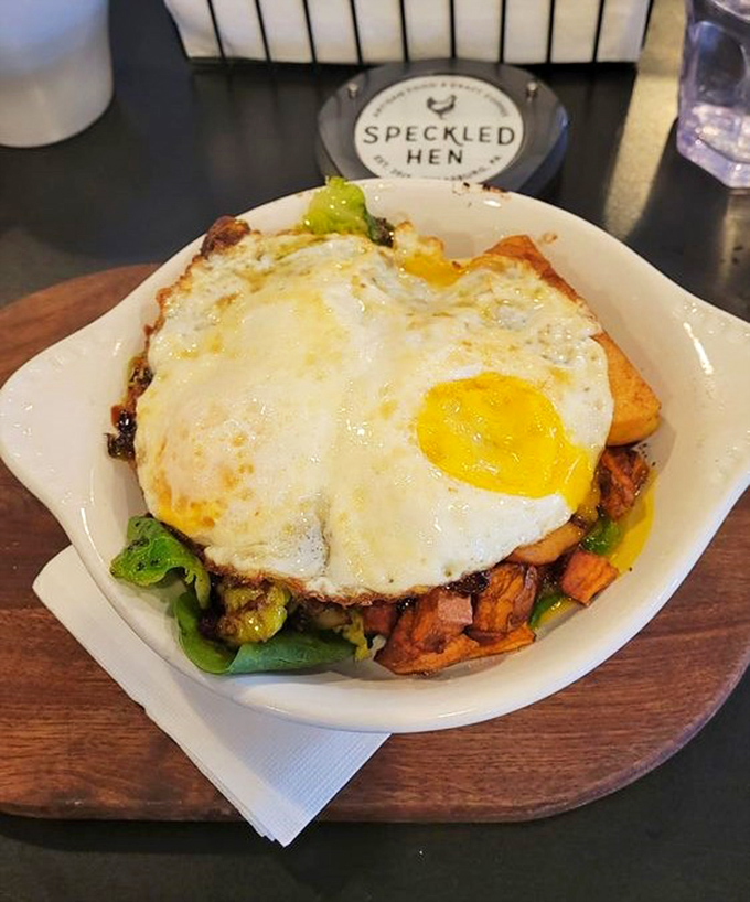 Breakfast architecture at its finest! Sweet potatoes, veggies, and a perfectly fried egg create a morning masterpiece that makes hitting the snooze button seem like a crime.