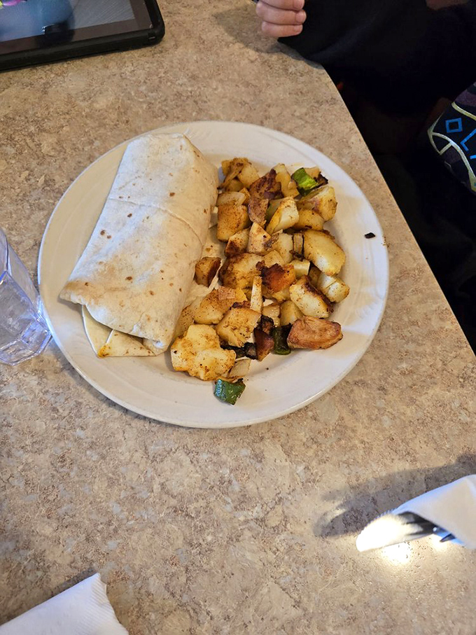 Breakfast burritos and home fries: the dynamic duo that makes getting out of bed worthwhile, especially when they're this generously portioned.