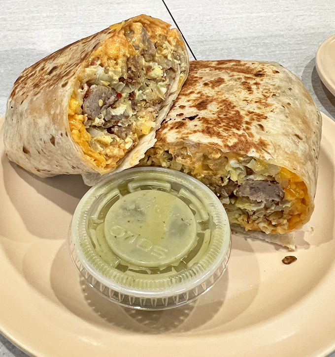 Breakfast burritos that mean business: eggs, cheese, and meat wrapped in a tortilla tighter than your grandmother hugs at Thanksgiving.