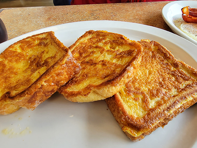 Golden-brown French toast with that perfect caramelized edge that makes you wonder if breakfast might actually be the superior meal of the day.