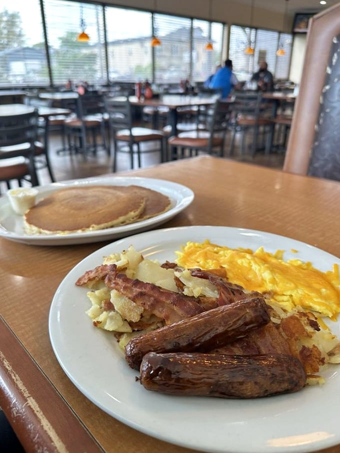 Breakfast perfection on a plate: golden-brown sausage links, perfectly scrambled eggs, and home fries that make you question all other potatoes.