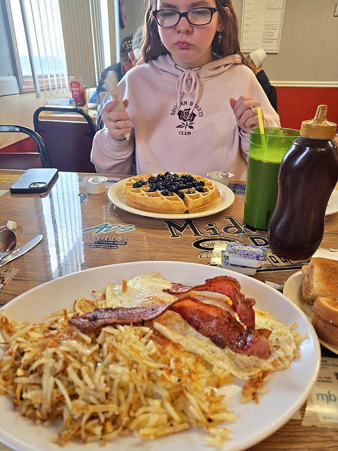 Breakfast nirvana: perfectly crispy hash browns, eggs with just-right yolks, and bacon that would make vegetarians question their life choices.
