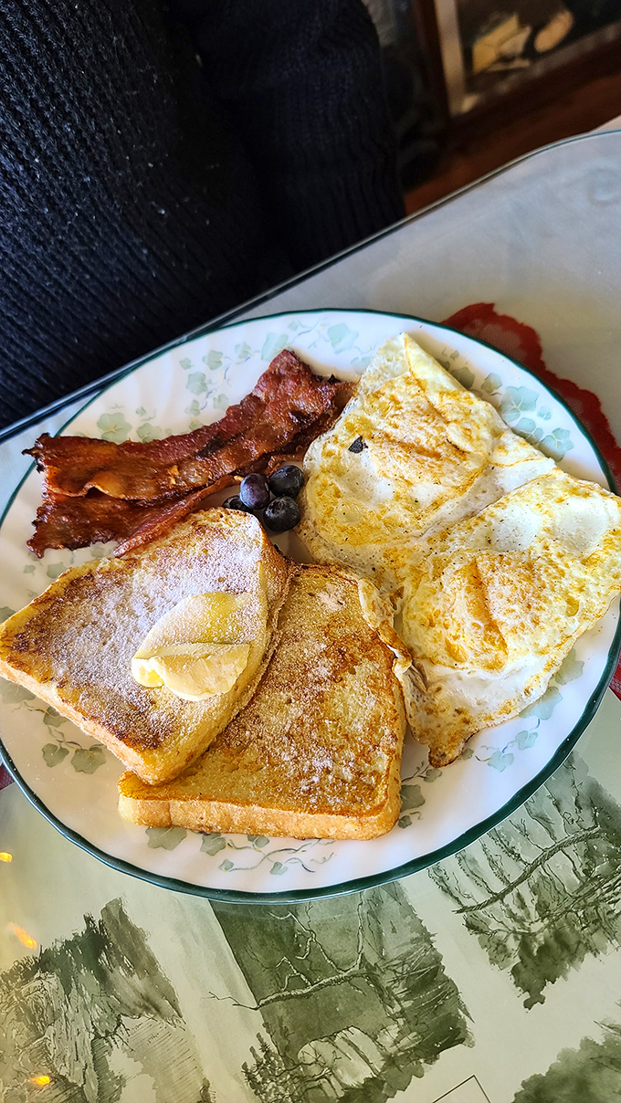 Breakfast perfection doesn't need fancy names. Golden toast, perfectly cooked eggs, and bacon that actually tastes like pork rather than liquid smoke.