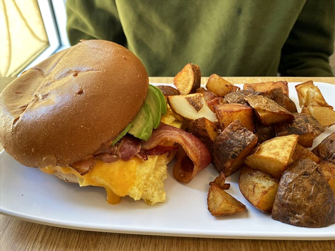 Breakfast sandwiches should be knighted for heroism. This one, with its perfect egg, melty cheese, and crispy potatoes, deserves a medal of honor.