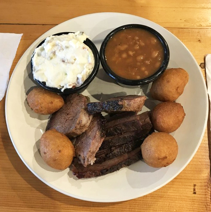 Brisket that doesn't just fall apart&mdash;it practically surrenders to your fork after its 12-hour smoke bath. Those hushpuppies aren't bad company either.