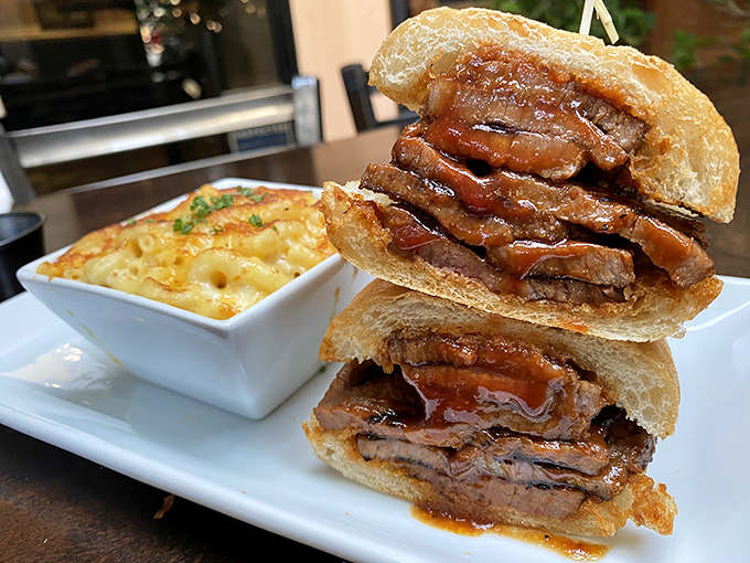 Behold the brisket sandwich in all its glory! Tender, smoke-kissed meat stacked high with that perfect bark, alongside mac and cheese that's not playing second fiddle.