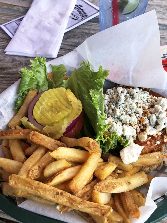 The Buffalo Chicken Sandwich arrives with sweet potato fries that could make a grown person weep tears of joy.
