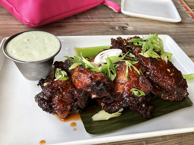 These buffalo wings arrive like golden treasures, each one promising that perfect balance of heat and flavor.
