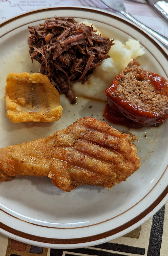 Comfort food's greatest hits album on a single plate. That pot roast looks tender enough to cut with a harsh glance.