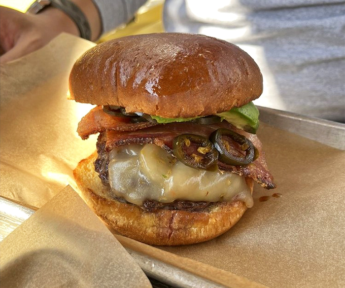 This isn't just a burger&mdash;it's a masterclass in umami, with melted cheese cascading over a perfect patty, topped with jalape&ntilde;os and bacon.