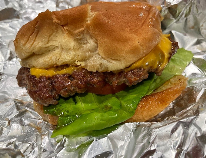 This isn't just a burger&mdash;it's edible poetry. The melty cheese cascading over a perfectly seared patty tells you everything.