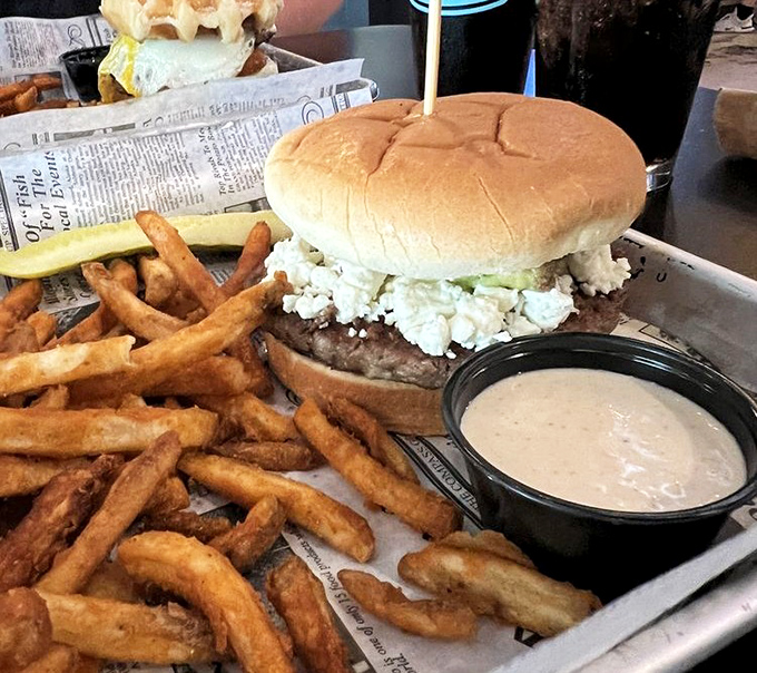 Blue cheese crumbles cascade down this burger like snow on a delicious mountain. Those fries aren't just a side dish&mdash;they're co-stars in this production.